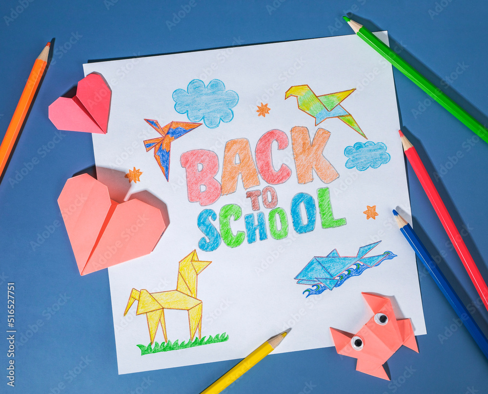 back to school children's drawing with colored pencils and origami ...