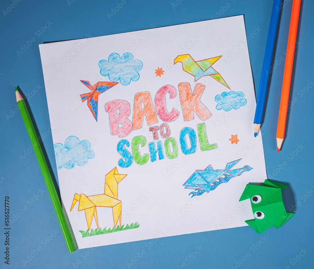 back to school children's drawing with colored pencils and origami ...