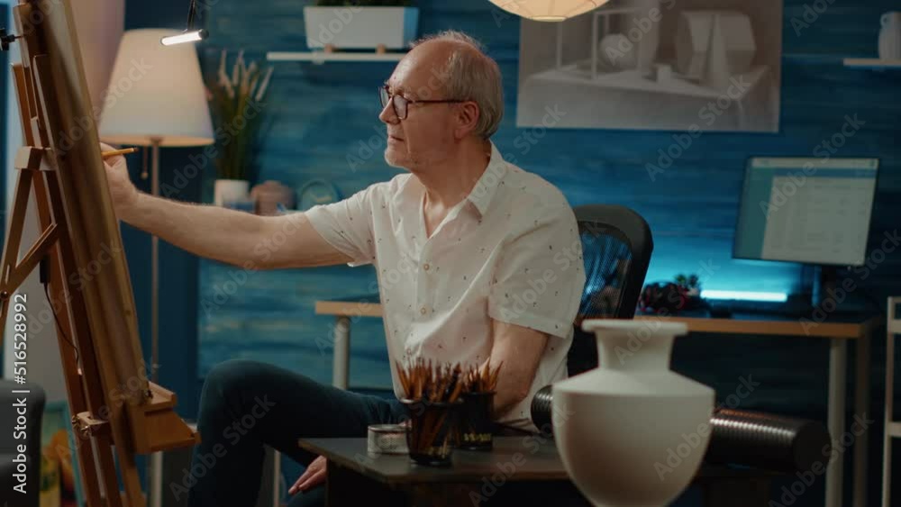 Old artist using pencils to draw professional masterpiece on canvas ...