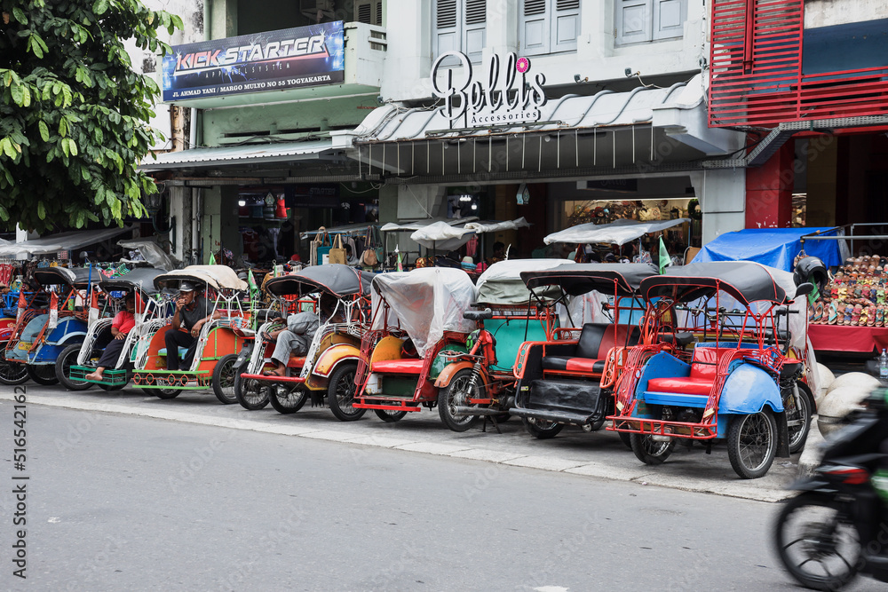 Yogyakarta, Indonesia - May 2022: Becak parked on the road side of ...