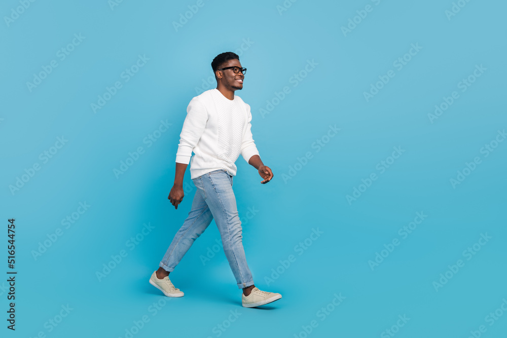 Full size profile portrait of satisfied glad young person walk look ...