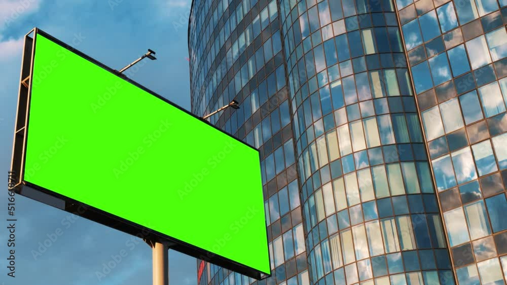Advertising billboard green screen chroma key against a glass office ...