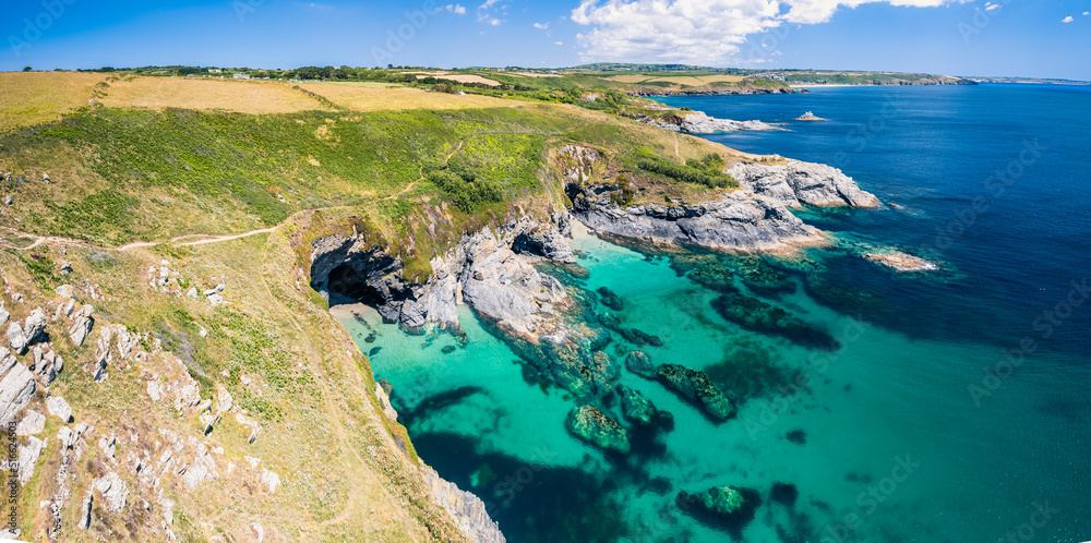 Top Down over Piskies Cove and HMS Warspite Cliffs from a drone ...