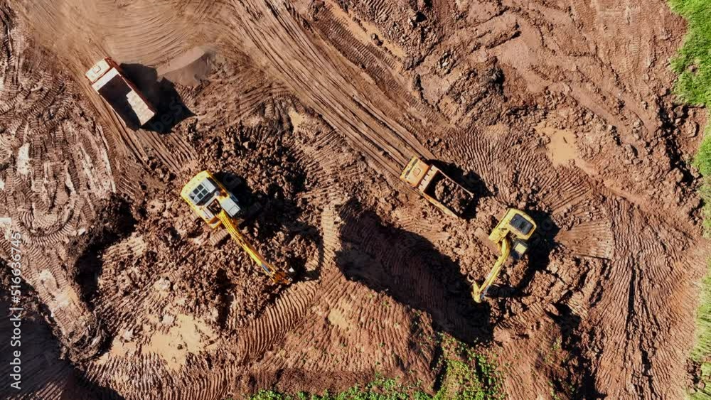 Excavator during clay mining. mining in open pit. Aerial view of an ...