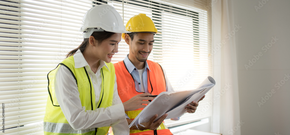 Engineer and architect smiling Discuss, review the construction ...