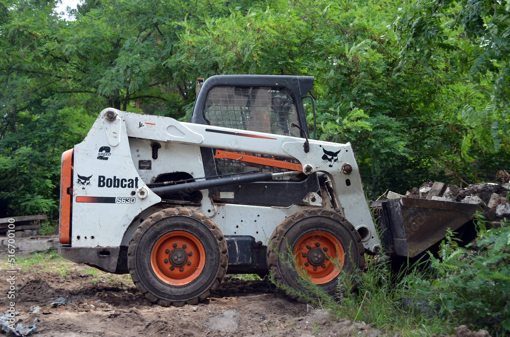 Bulldozer on old house rebuilding. 11 July 2022. Kiev Region, Ukraine ...