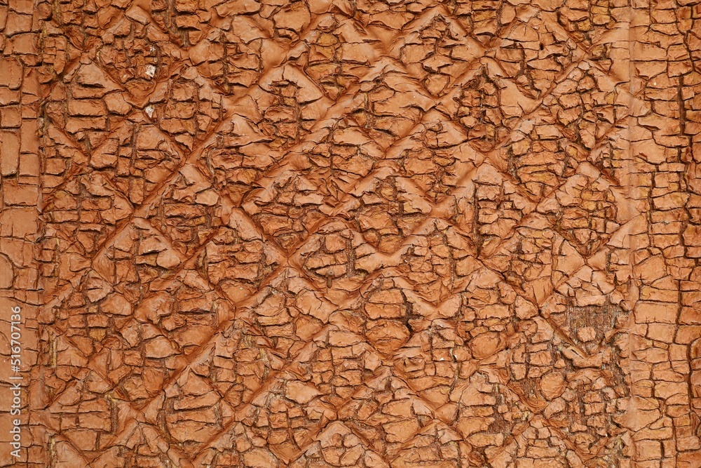 The terracotta surface is old and cracked. Stock Photo | Adobe Stock