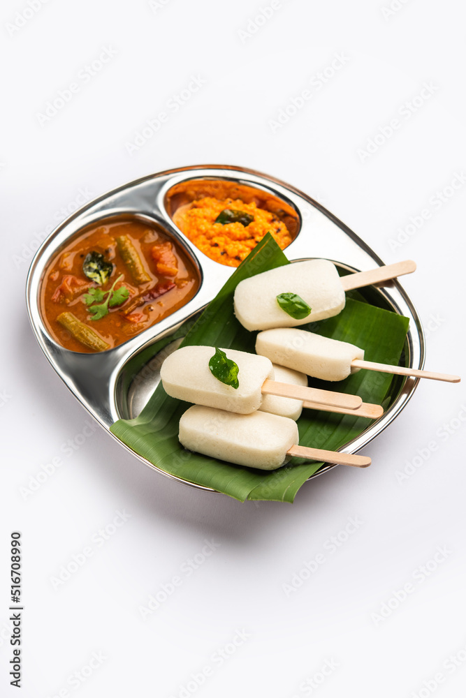 Idly lollipop or idli candy with stick served with sambar and chutney ...