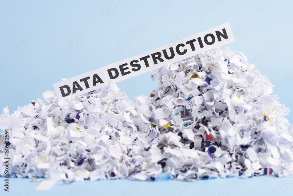 Words Data destruction on top of heap of cross shredded paper concept ...