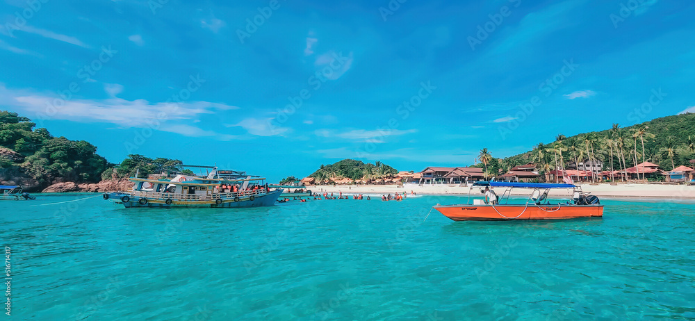 Redang, Malaysia - May 10, 2022 Boats, turquoise water and white sand ...