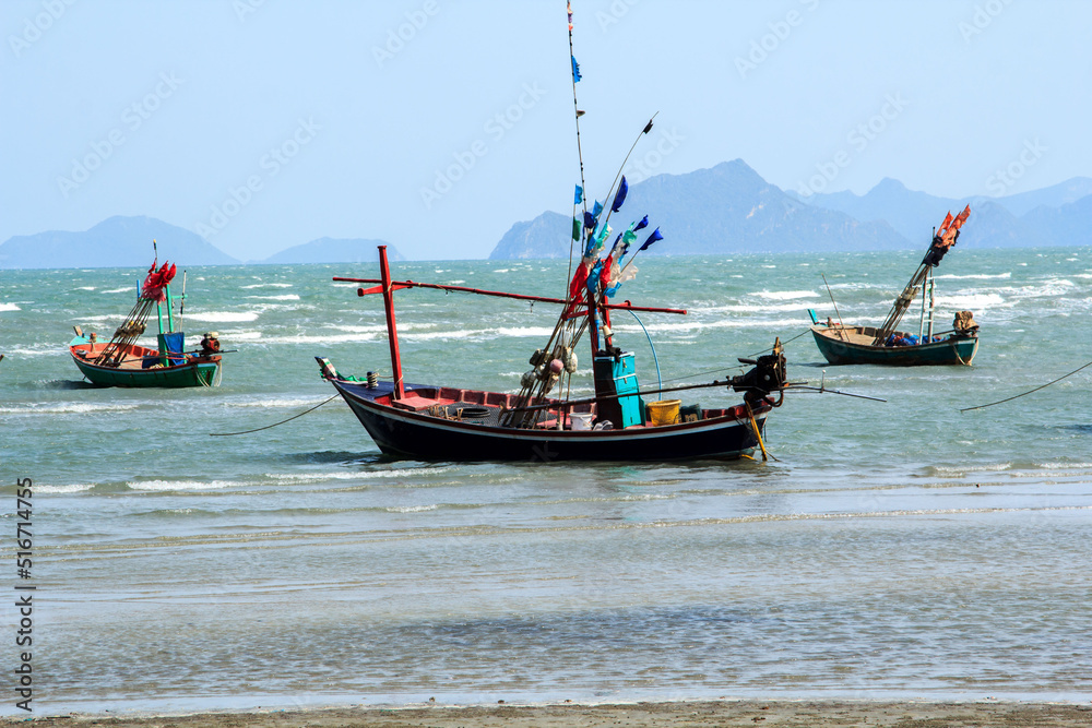 small fishing boat that catches fish and squid along the coast in a ...