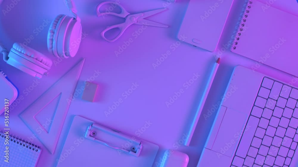 Creative layout made of school supplies on holographic neon background with copy space. Flat lay ...