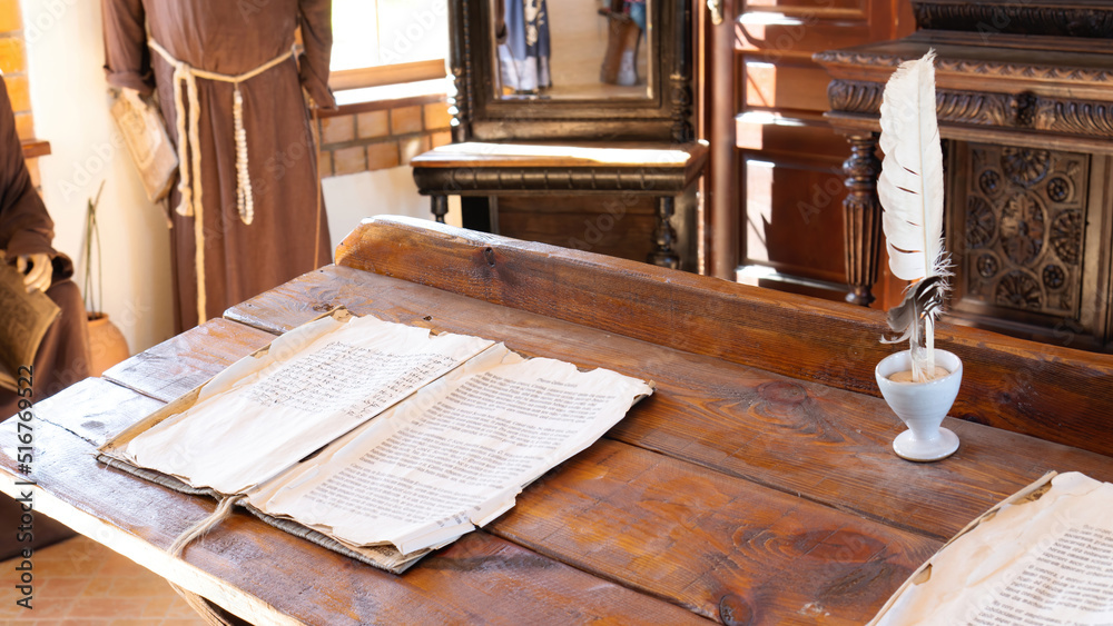 School class in ancient times. An old manuscript on a wooden desk for ...