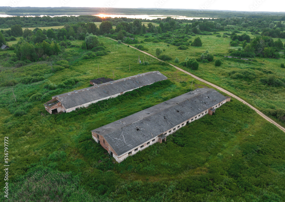 Abandoned farm. Old farm building with a destroyed cowshed. Abandoned ...