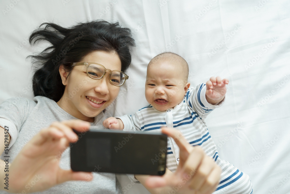 Chinese Little baby boy crying while having Video call with his mother ...