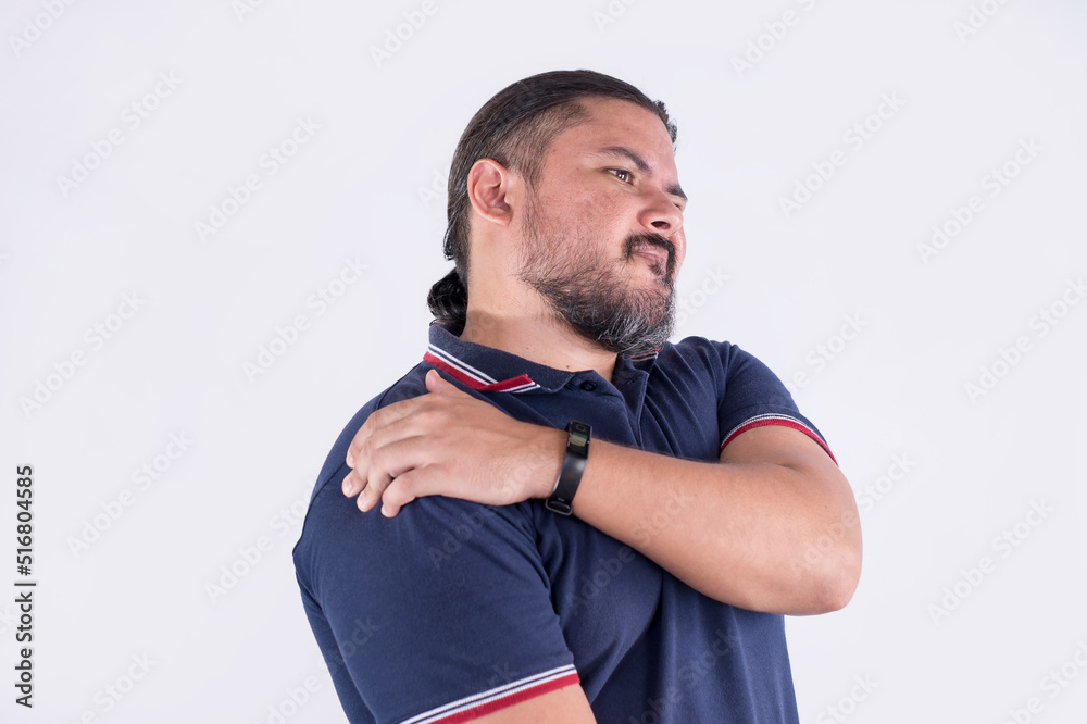 A man experiencing a stiff shoulder. Frozen shoulder, also known as ...