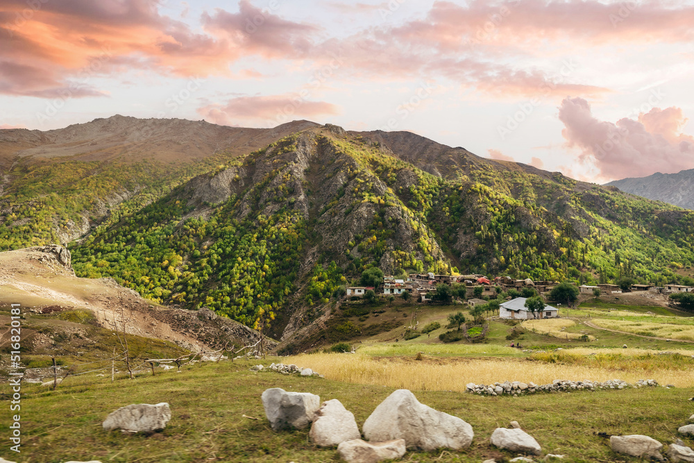 wide nature landscape of Pakistani village homes on a hill in mountains ...