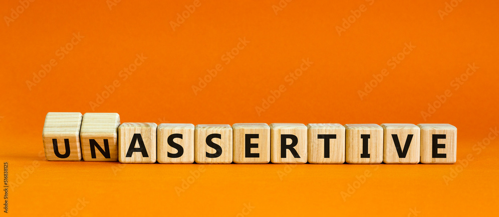 Assertive or unassertive symbol. Turned wooden cubes and changed ...