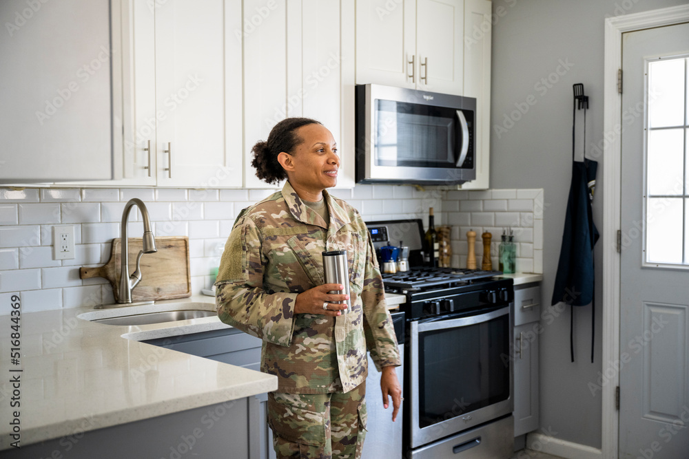 U.S. Army female soldier in her kitchen Stock Photo | Adobe Stock