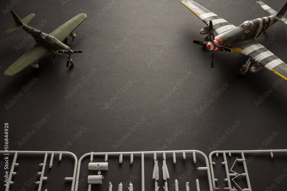 Scale model of a fighter aircraft with details and tools. Plastic ...