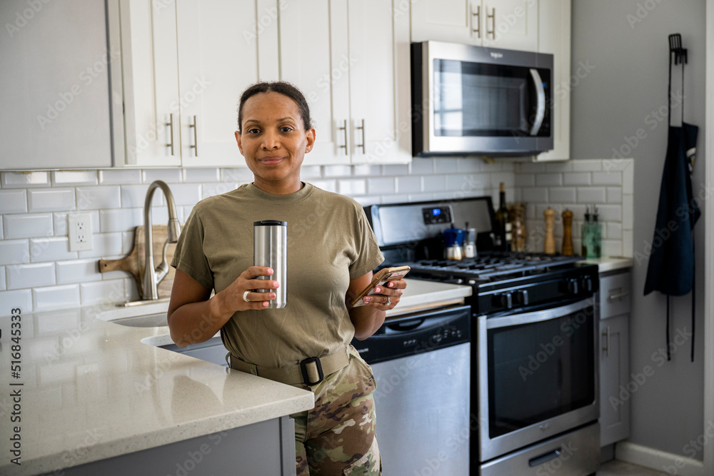 U.S. Army female soldier in her kitchen Stock Photo | Adobe Stock