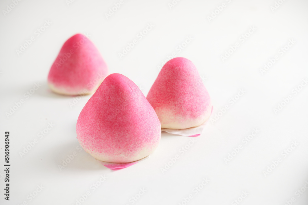 Steam buns on white background. A peach-shaped birthday bun known as ...