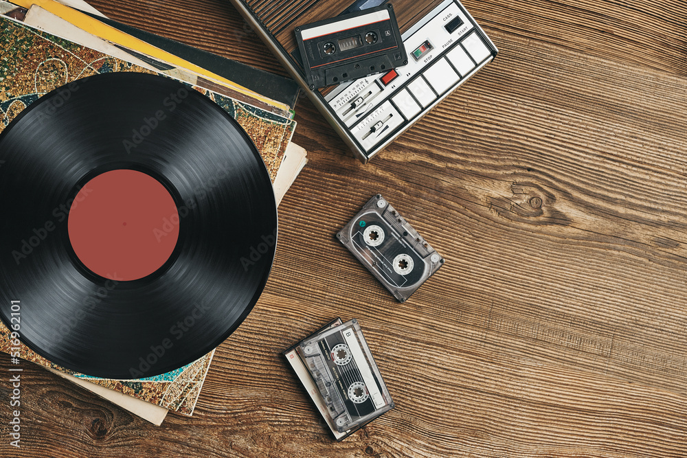 Vinyl records, cassette tapes and cassette recorder. Retro music style ...