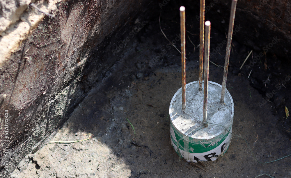 Cement work in progress. Foundation strength work. Bucket of concrete ...