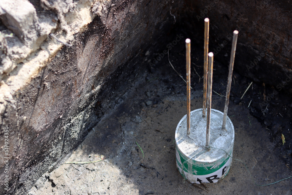 Cement work in progress. Foundation strength work. Bucket of concrete ...