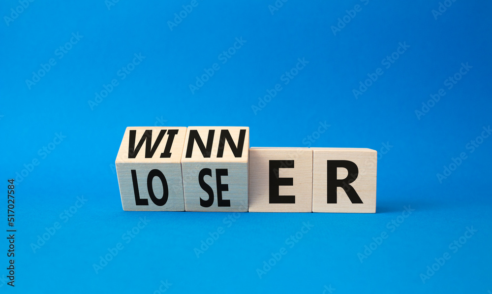 Winner and Loser symbol. Turned wooden cubes with words Winner and ... Winner and Loser symbol. Turned wooden cubes with words Winner and ...