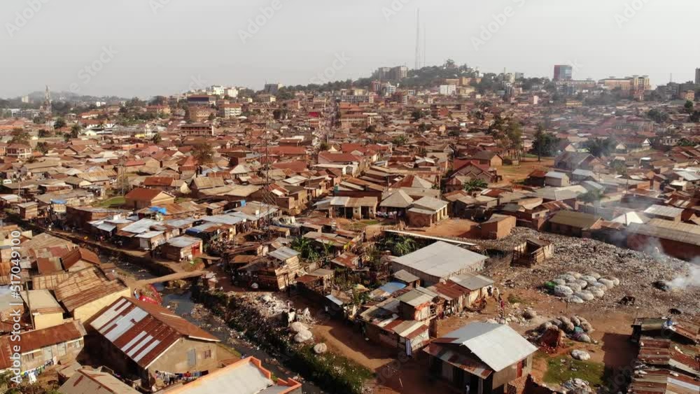 Drone shot over the slums of Uganda, going backwards. High quality 4k ...