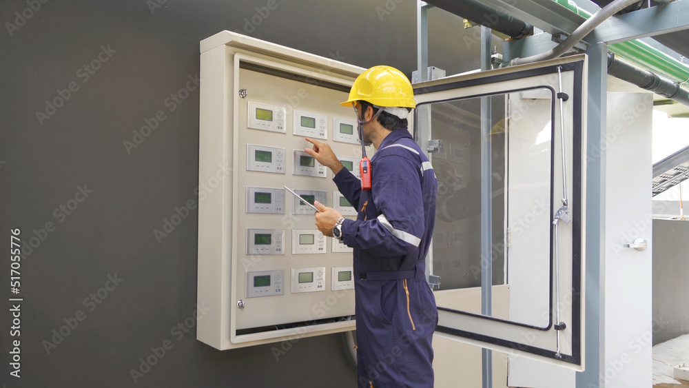 An engineer man or worker, people working in electrical room. Power ...