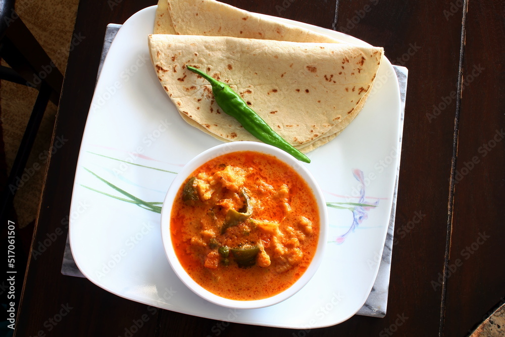 indian gujarati traditional dish food chapati or roti serve with mix ...