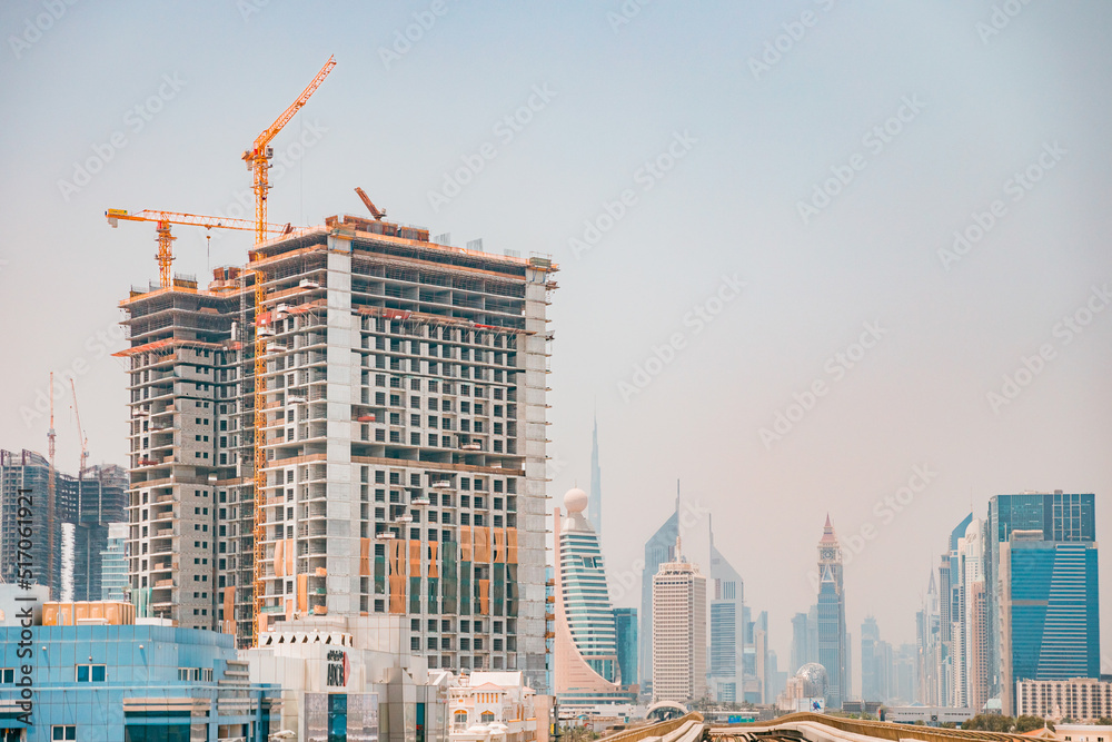 Dubai, UAE, United Arab Emirates - May 28, 2021: Construction crane is ...