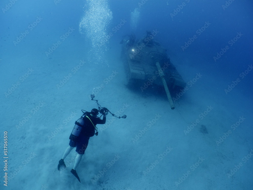 scuba diver exploring tank wreck underwater wreck dive blue water kas ...