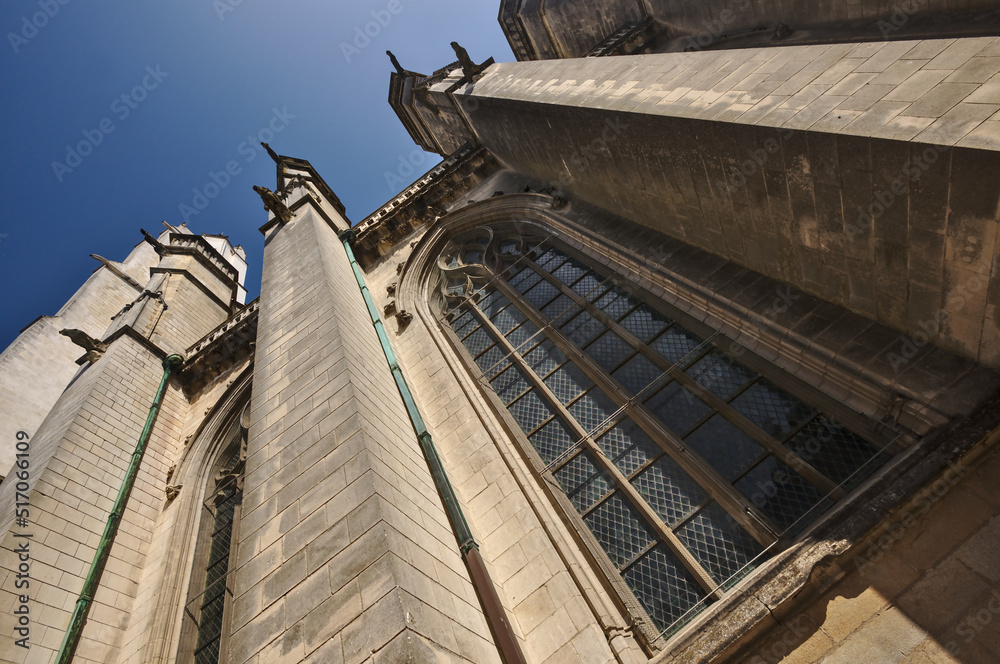 Horizontal close-up picture of exterior and stained glass window with ...