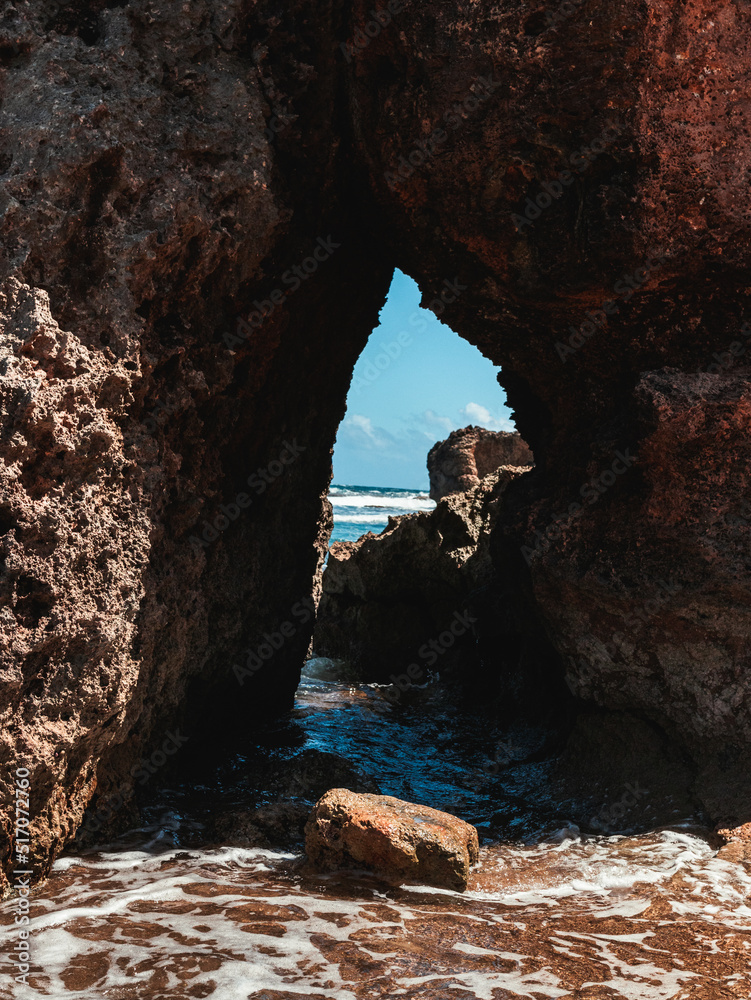 Foto de Puerto rico Aguadilla survival beach caves with big rocks ...