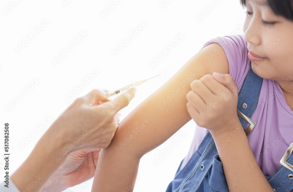 light and blur people, doctor inject vaccine to asian girl, Deltoid ...