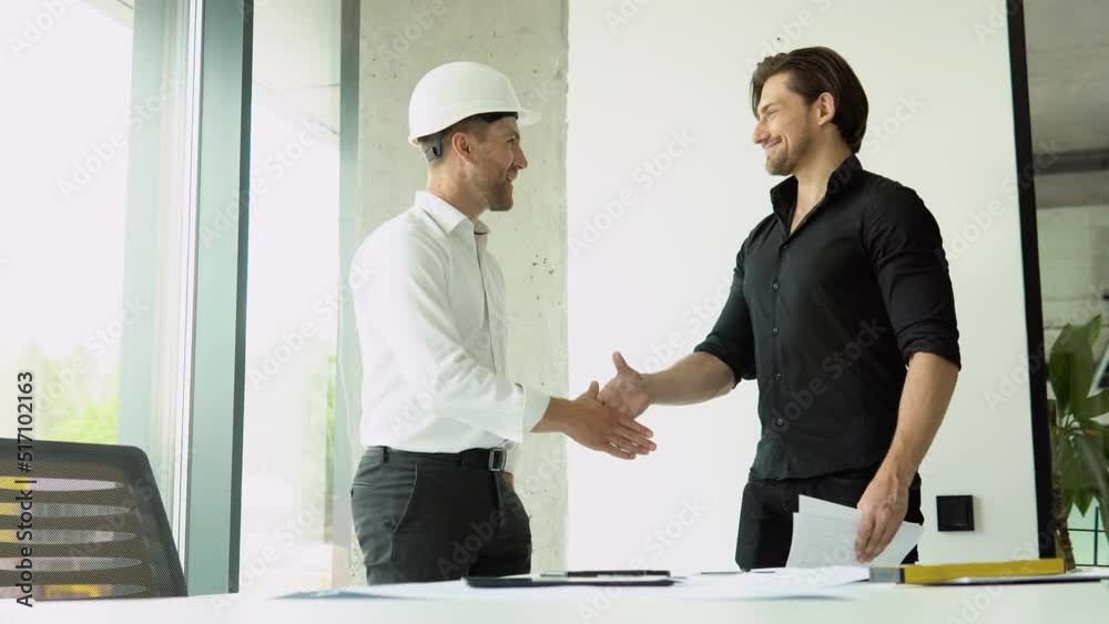 Two civil engineer handshake after mega project done. Handshake ...