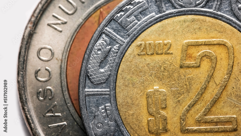 Close up shot of Mexican 2 peso coin is in the foreground. One Balboa ...