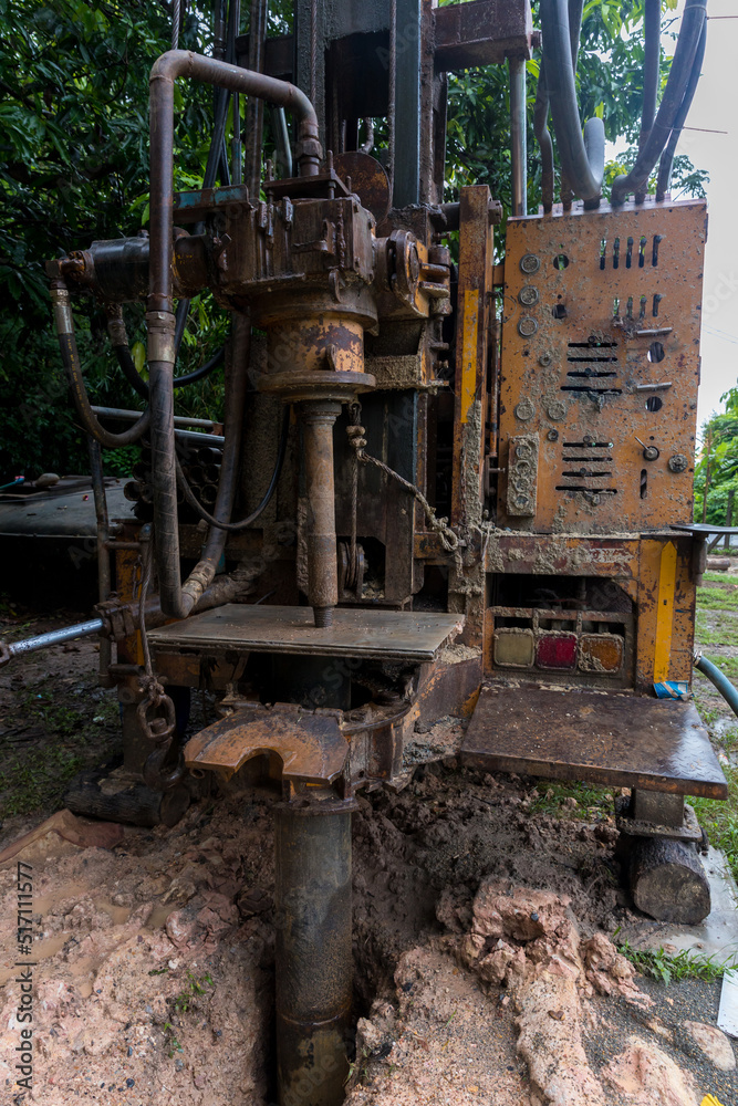 Ground water hole drilling machine installed on the old truck. Ground ...