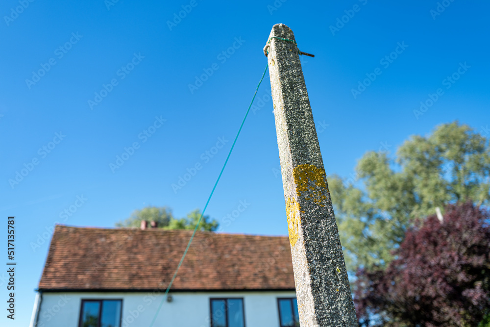 Shallow focus of a concrete clothes line post showing its rough texture ...