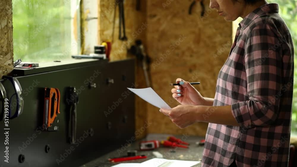 Female interior designer working on drawings, woman architect draws ...