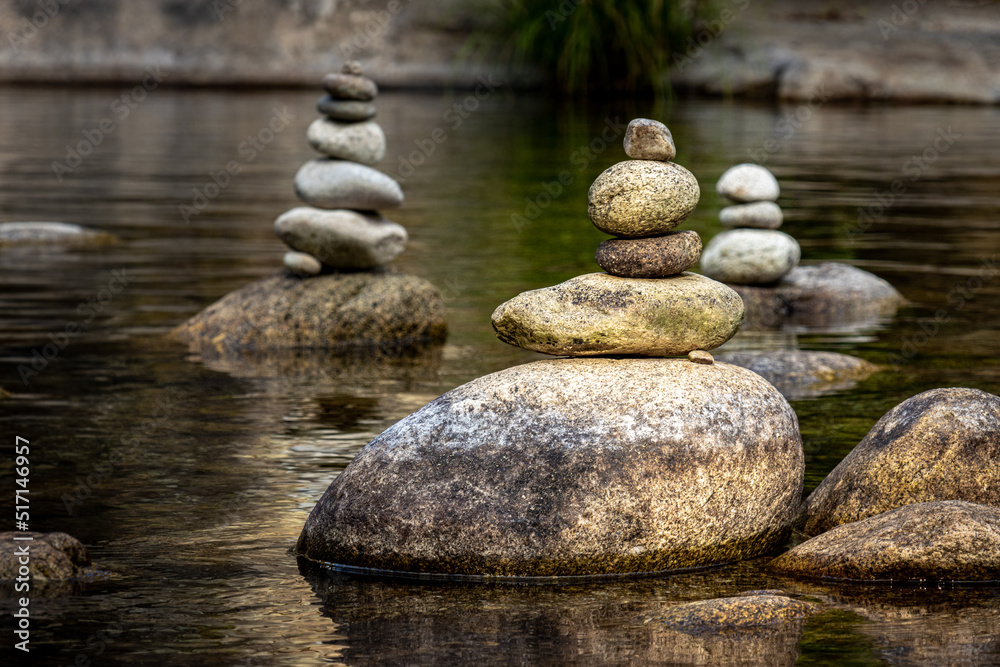 piedras apiladas en un río simbolizando el zen Stock Photo | Adobe Stock