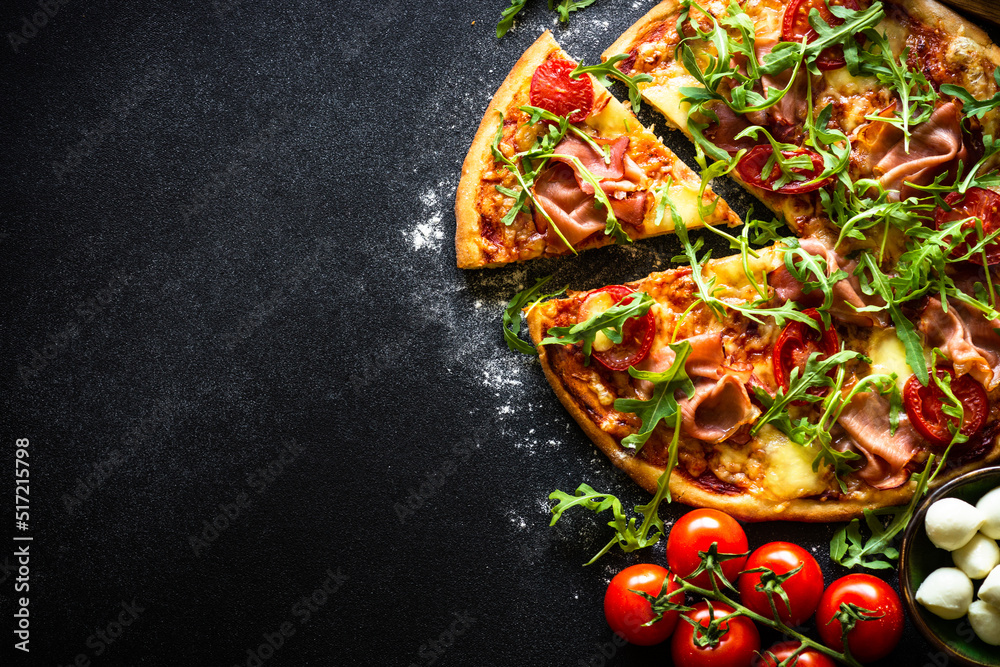 Pizza on black background. Traditional italian pizza with ham, cheese ...