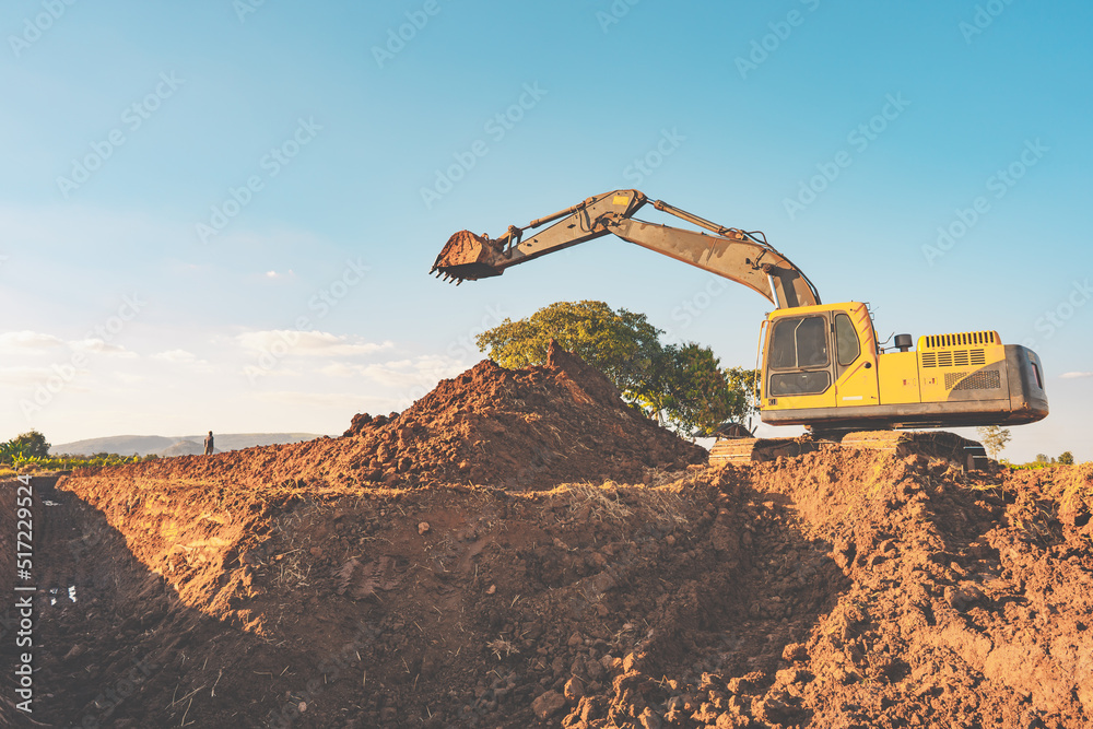 Excavator machine working and digging ground on blurred background ...