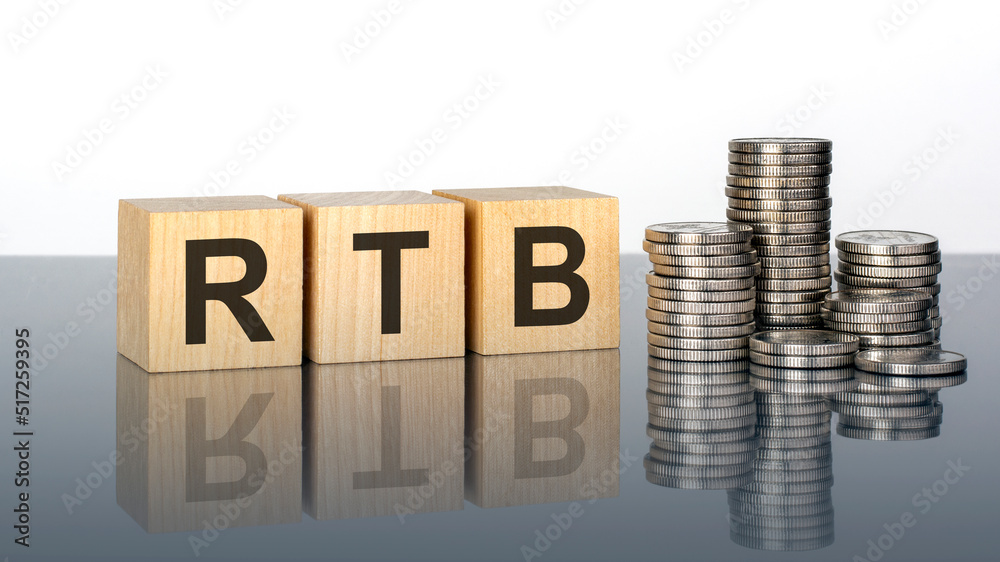 RTB - text is made up of letters on wooden cubes lying on a mirror ...