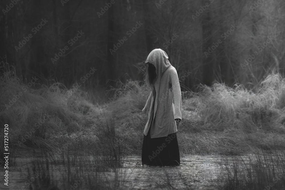 A mysterious figure in the marshes, a phantom, fear, dark mood. Horror ...