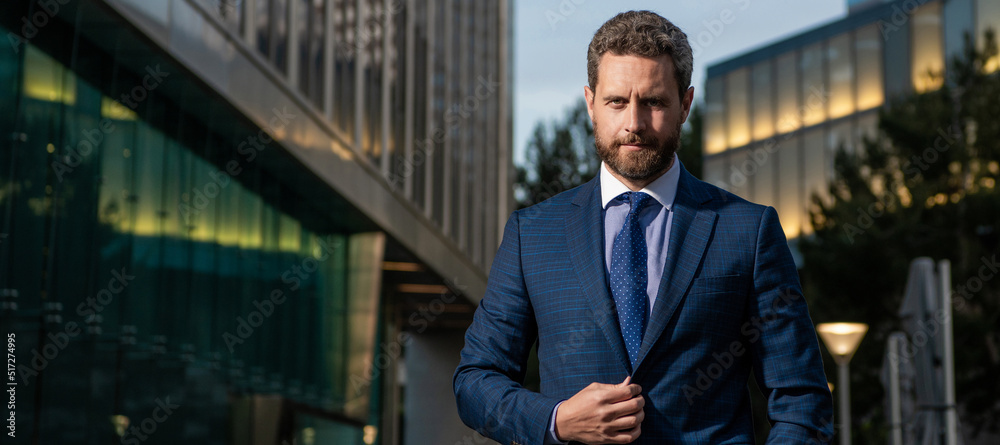 successful man in businesslike suit. manager executive outside the ...