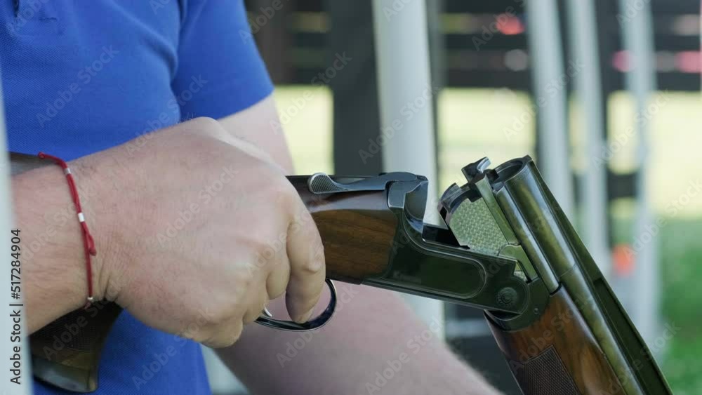 Stockvideon Sportsman shoots from a double-barreled shotgun, A sports ...